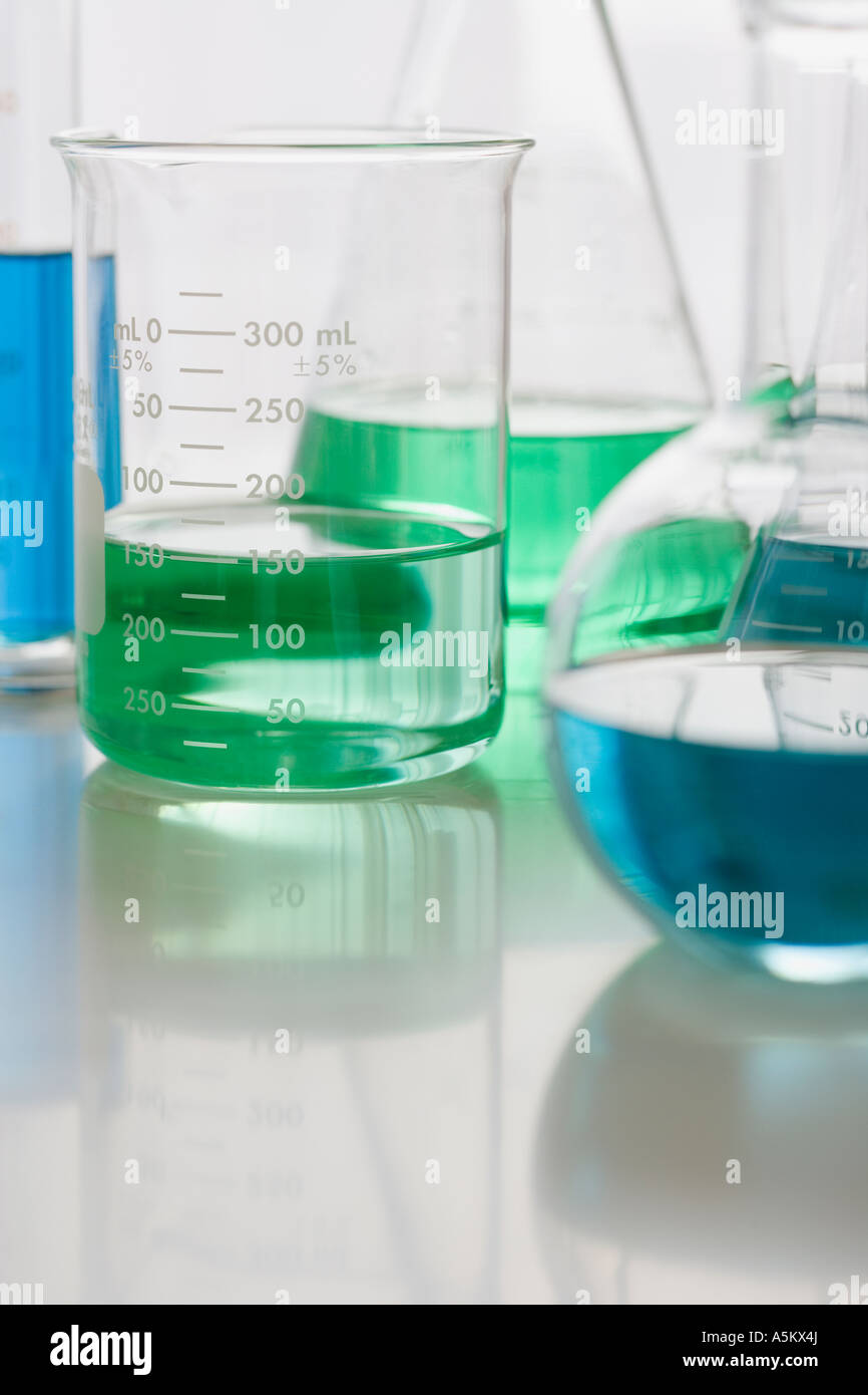 Close up of beakers with liquid Stock Photo - Alamy