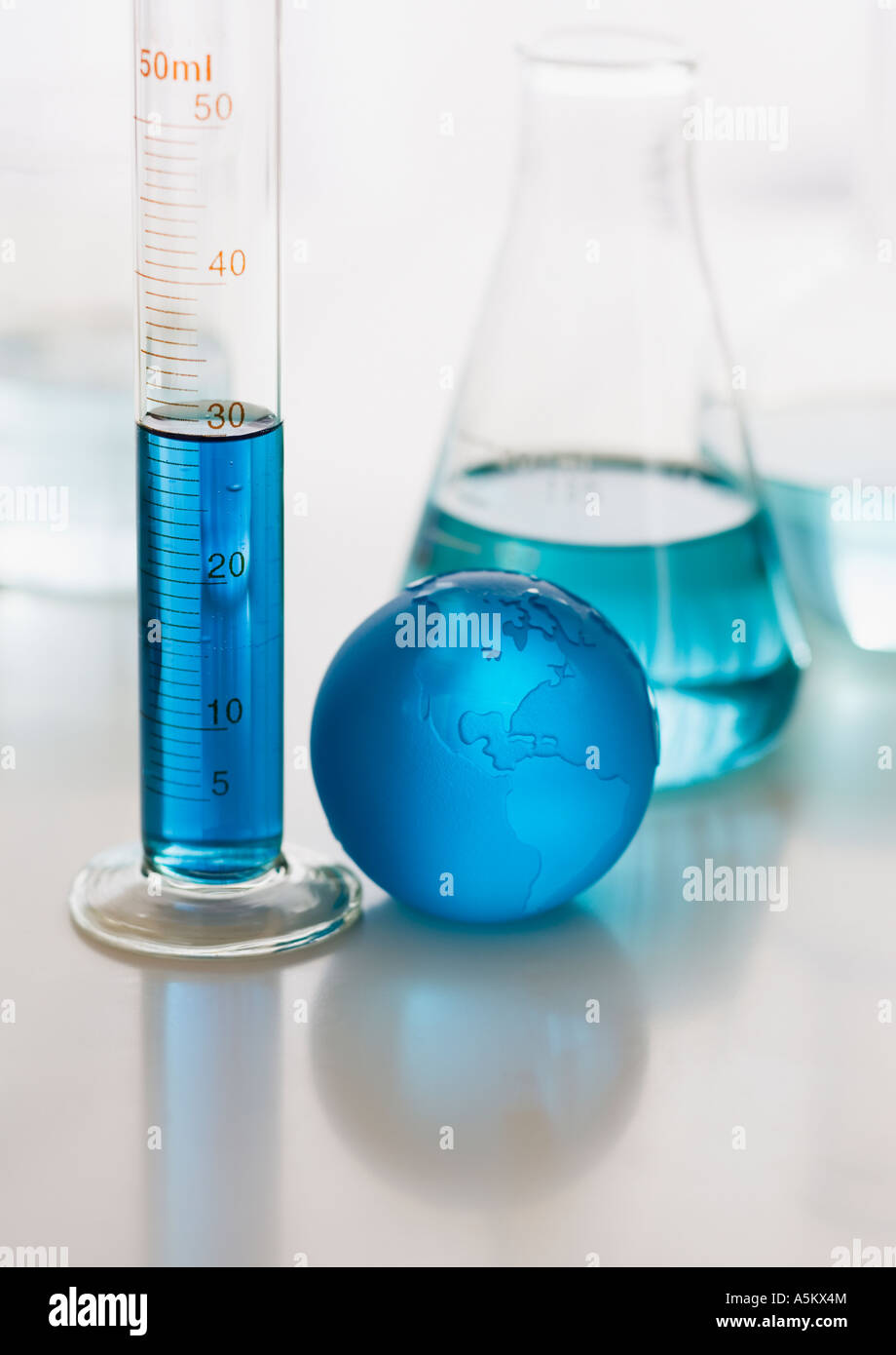 Close up of beakers with liquid Stock Photo - Alamy