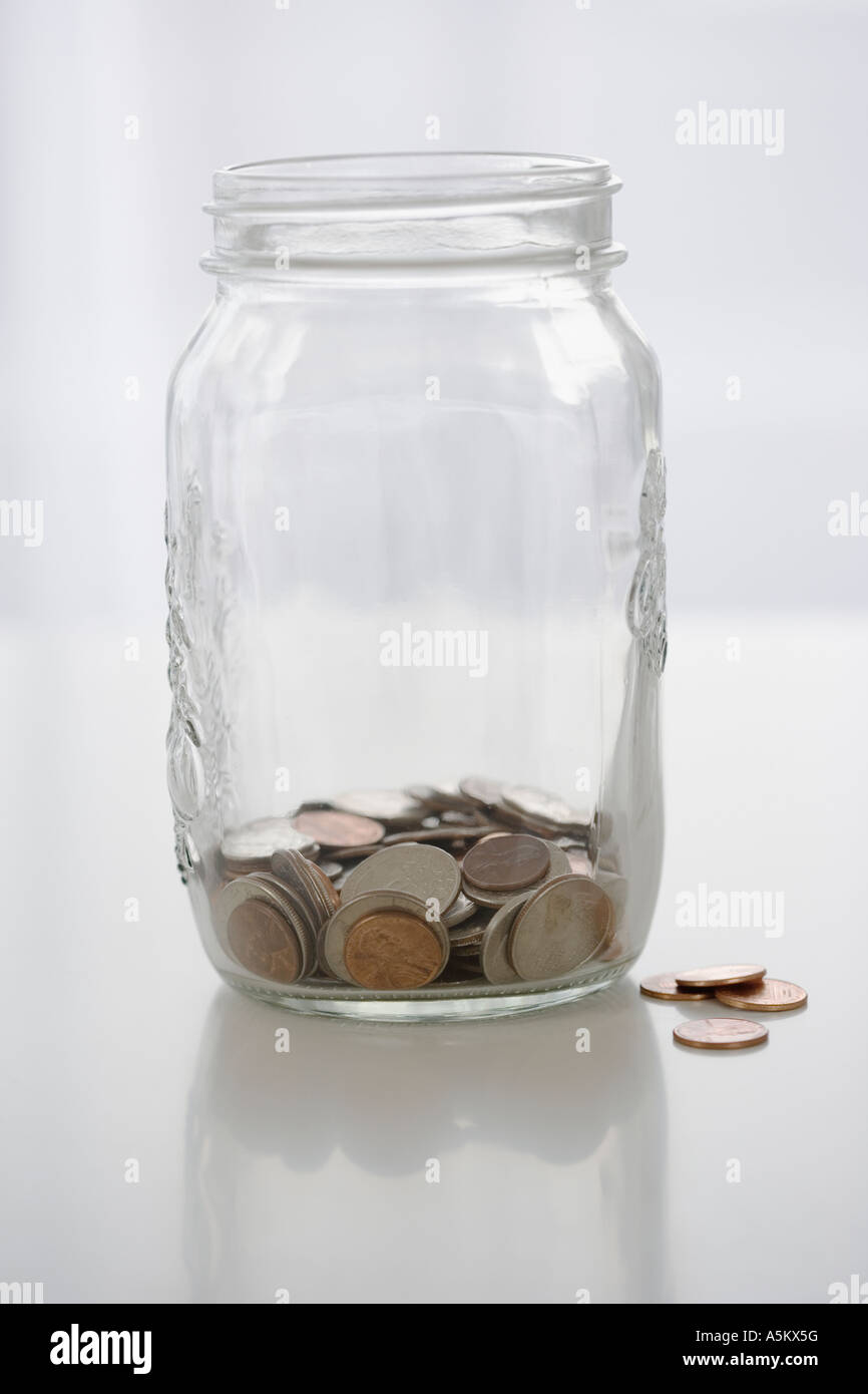 Mason jar with change Stock Photo - Alamy