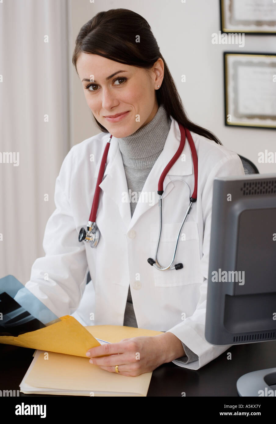 Portrait of female doctor in office Stock Photo - Alamy