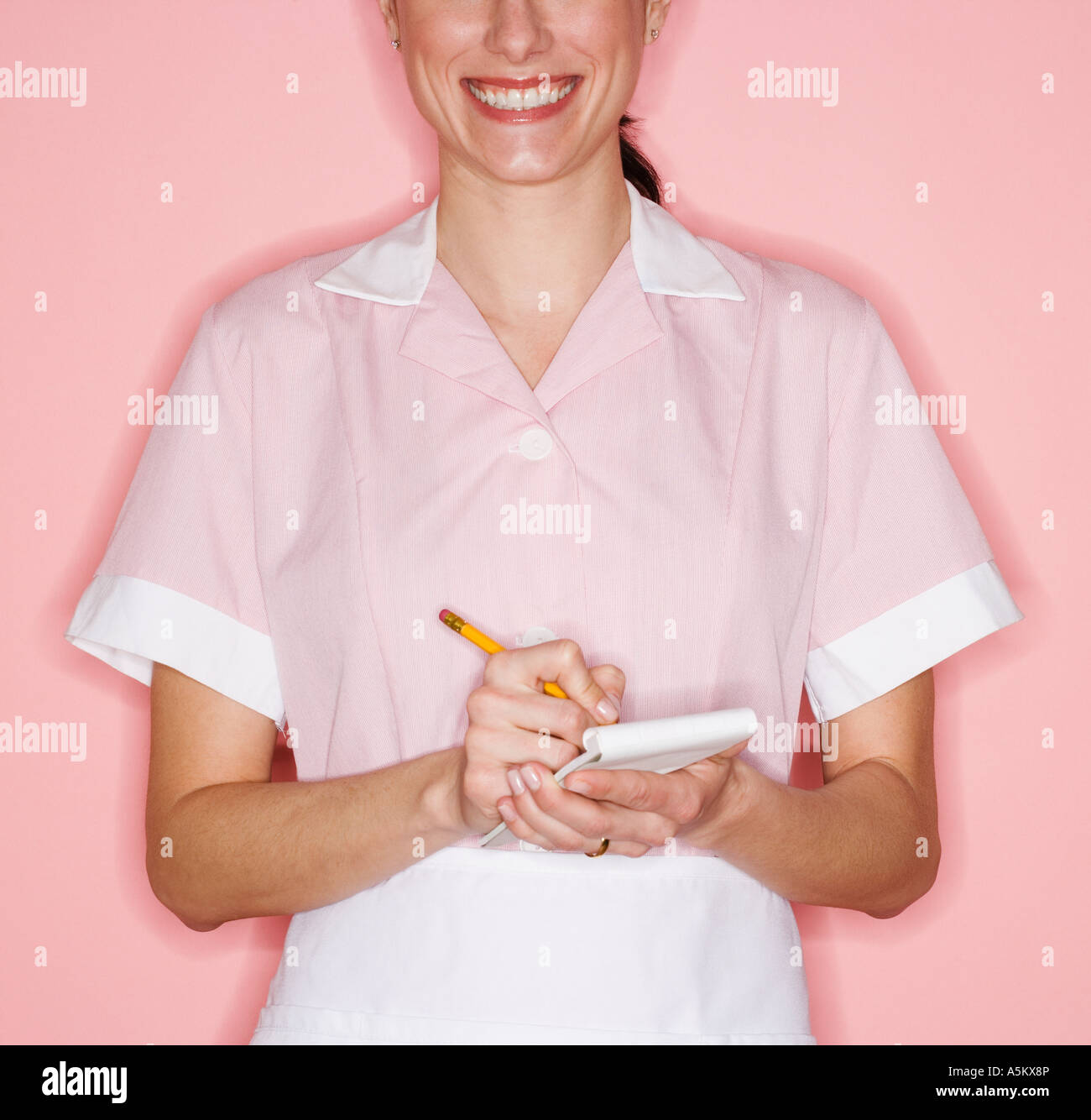 Waitress writing order on pad Stock Photo - Alamy