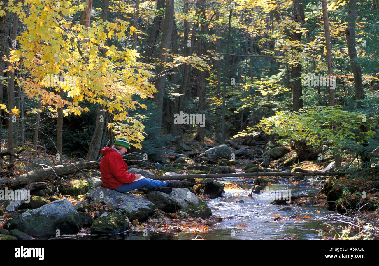One woman writing rock outdoors hi-res stock photography and images - Alamy
