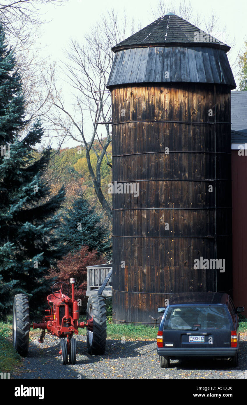 An old tractor next to the silo of the 1836 barn on the Henderson ...