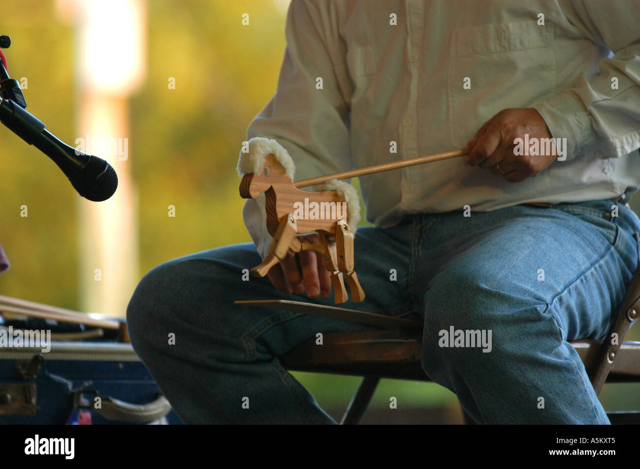 A man unseen is playing a traditional Appalachian musical instrument ...