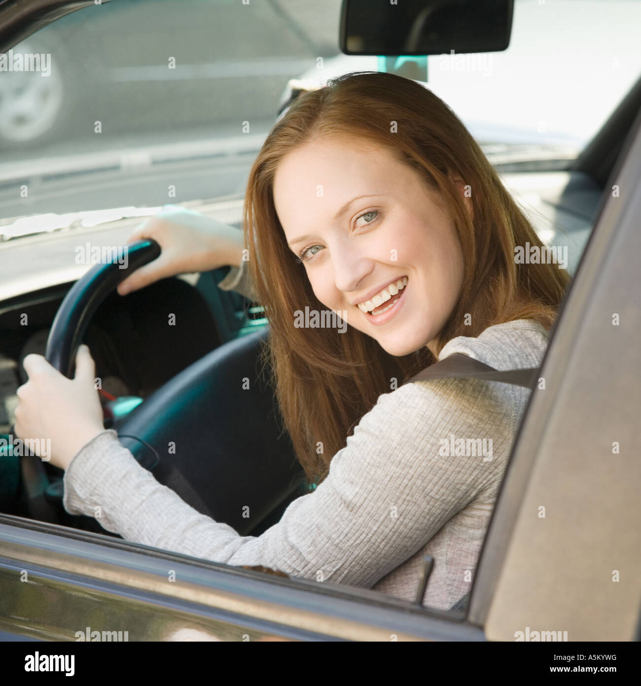 Portrait of woman driving car Stock Photo - Alamy