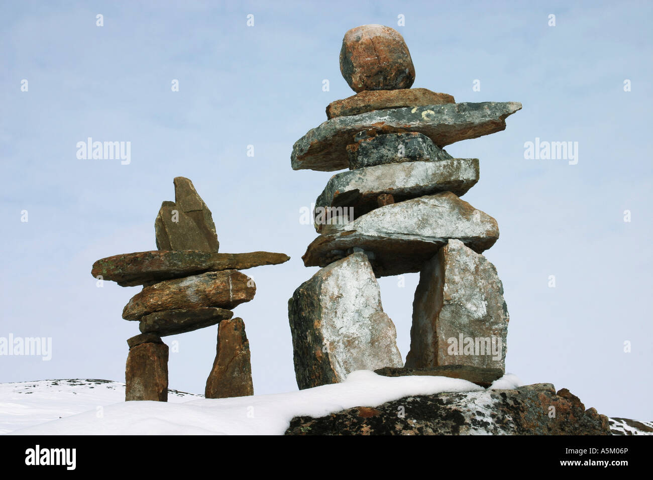 Two inuksuk, traditional Inuit stone landmarks or waymarkers, on a ...