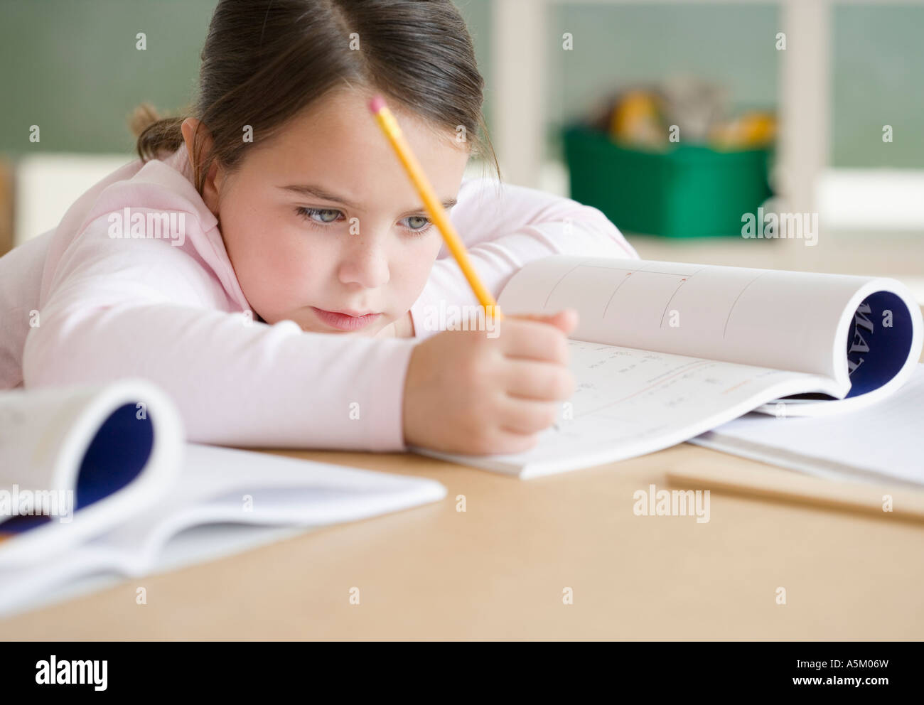 Girl studying in classroom Stock Photo - Alamy