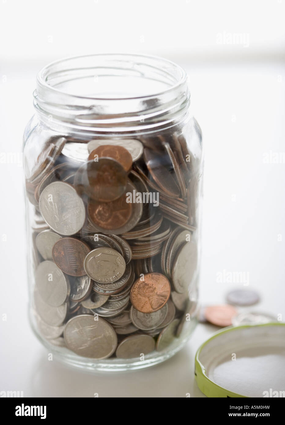 Close up of mason jar with change Stock Photo - Alamy