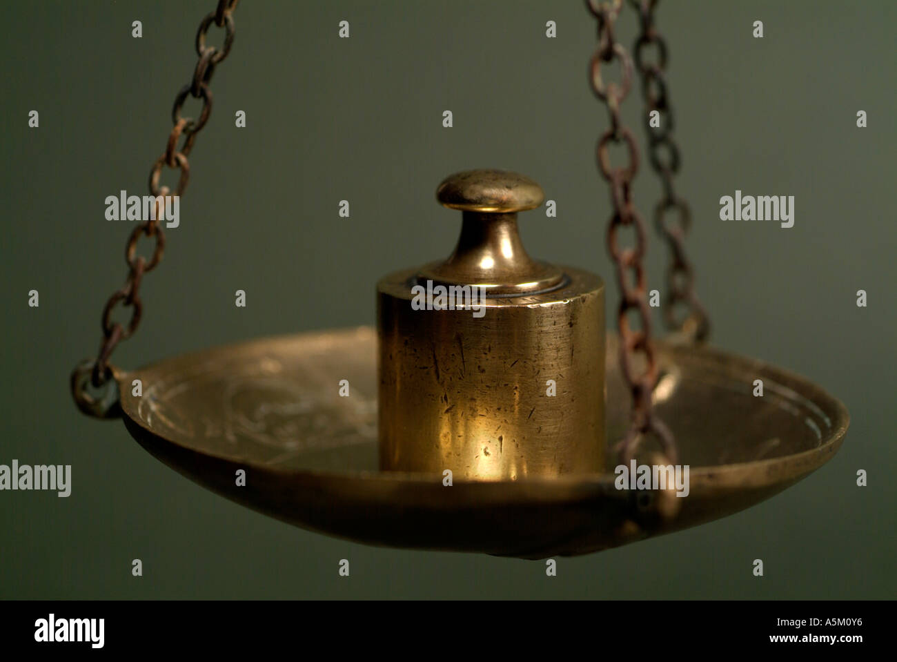 Group of French copper weights hanging on a scale Stock Photo - Alamy