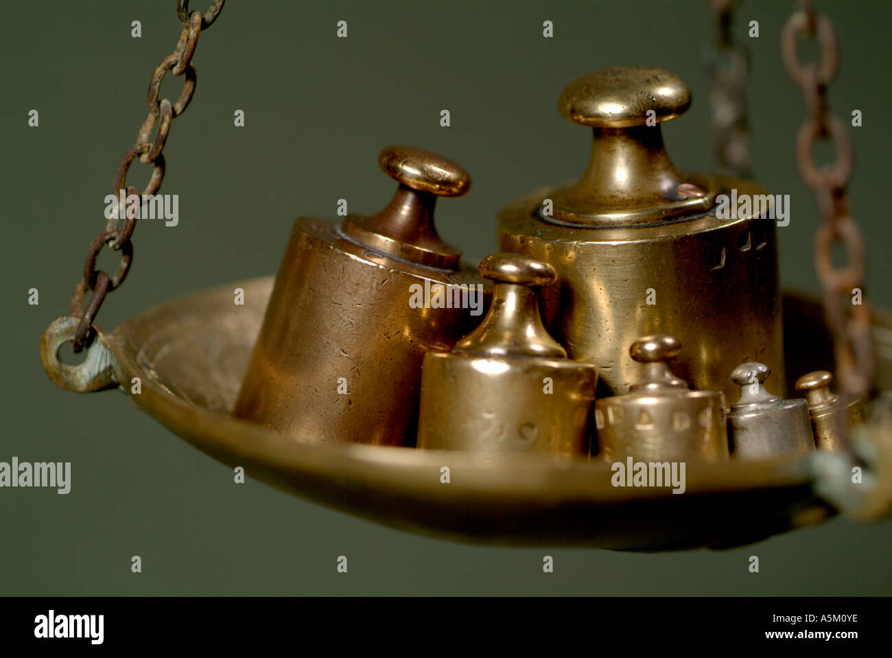 French copper weights on a scale Stock Photo - Alamy