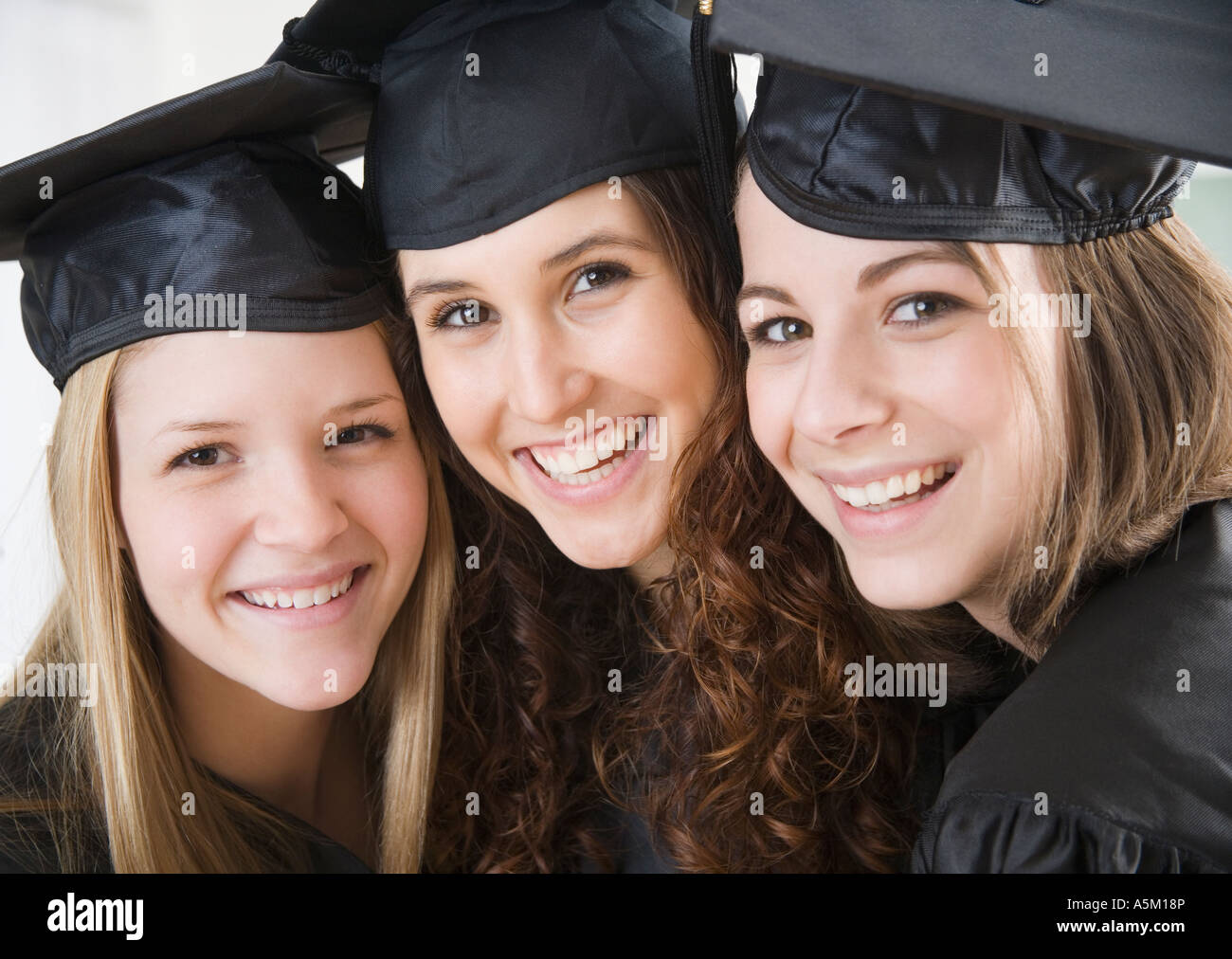 Portrait of teenage girls on graduation day Stock Photo - Alamy