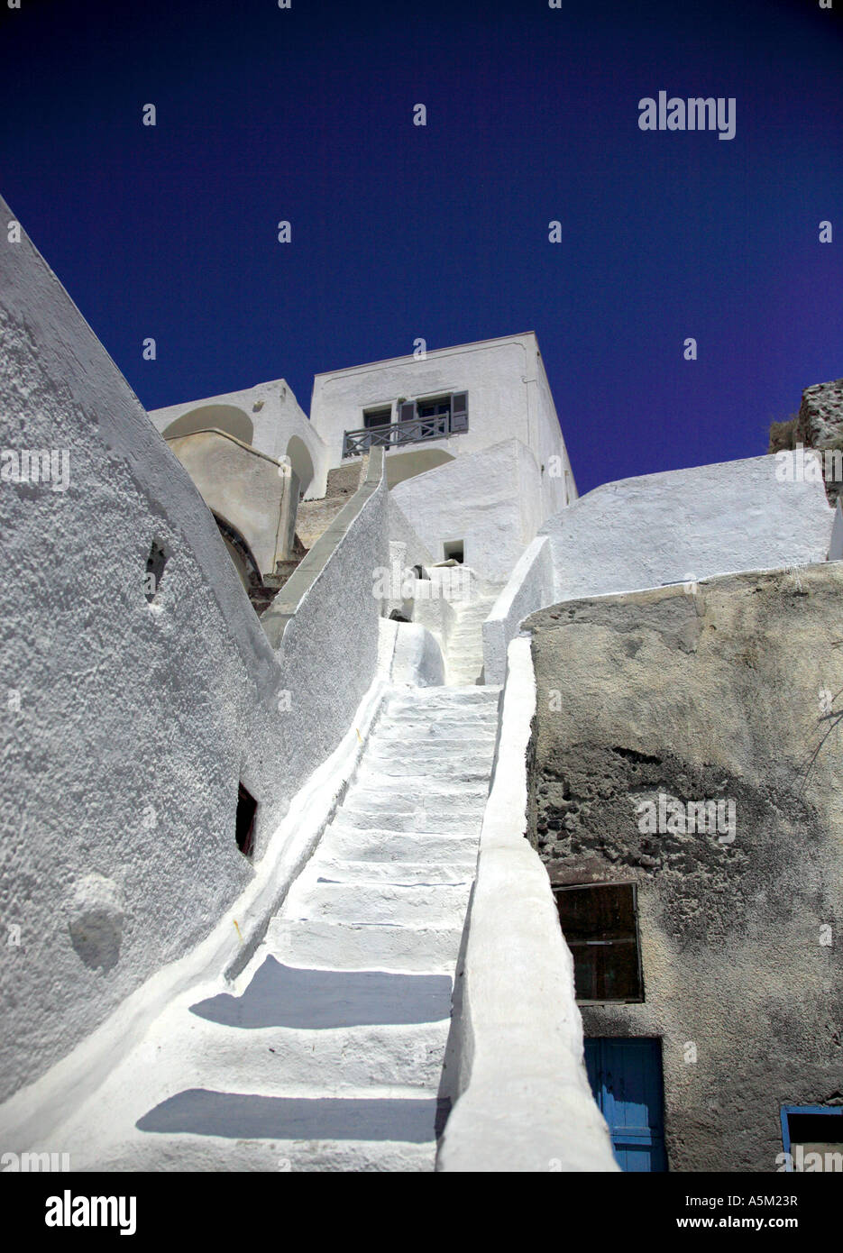 Whitewash Greek steps against a blue sky Oia Santorini Stock Photo - Alamy
