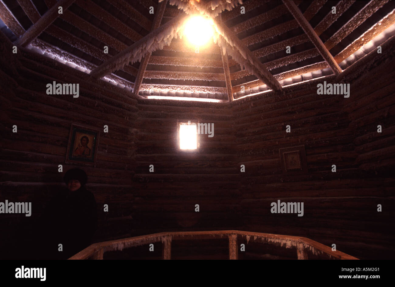 Siberian woman in the spring house, Koptelovo village in Siberia ...