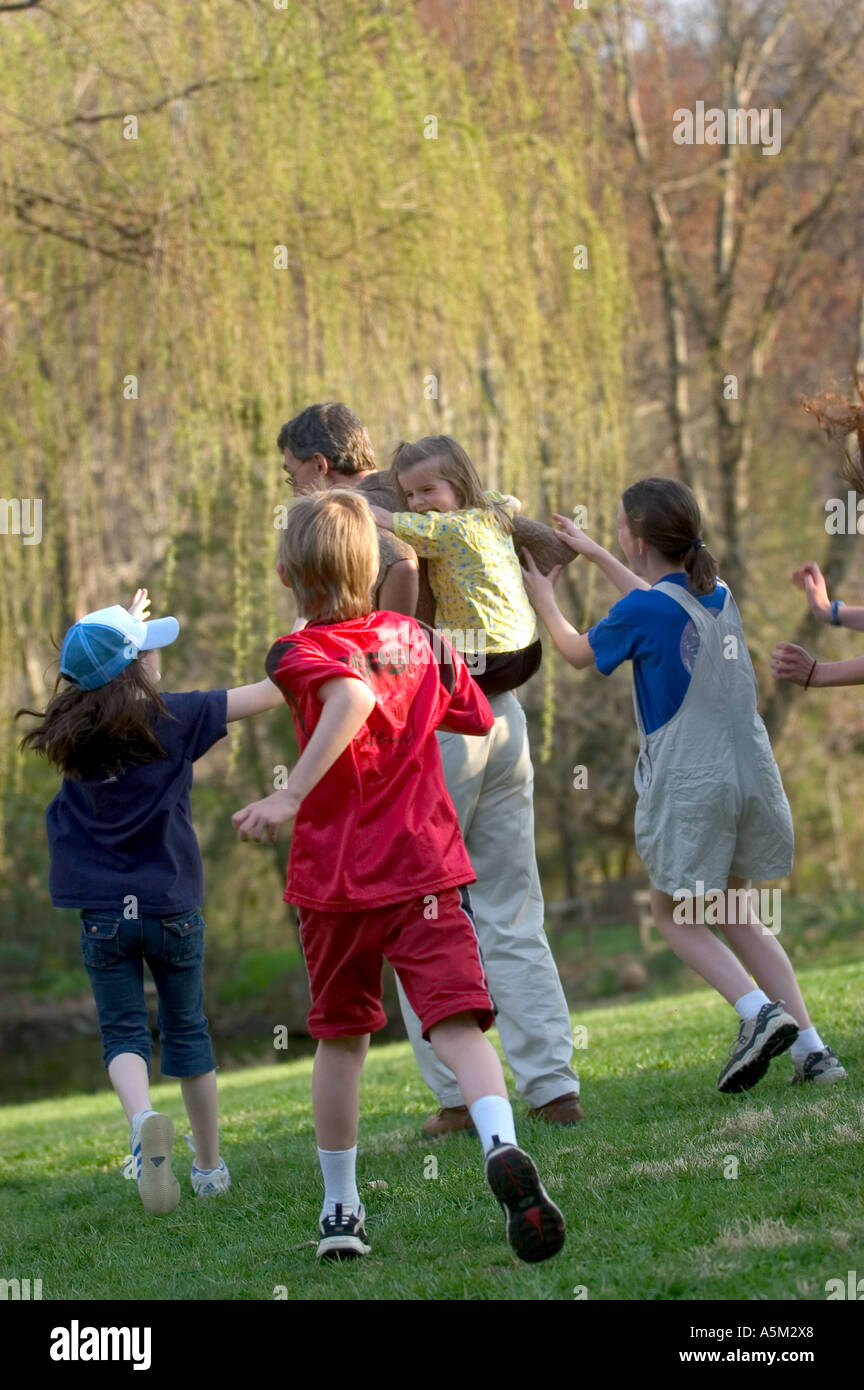 Children playfully chase hi-res stock photography and images - Alamy