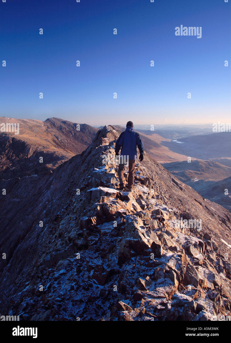 Walker on Crib Goch on The Snowdon Horseshoe ridgewalk Snowdonia ...
