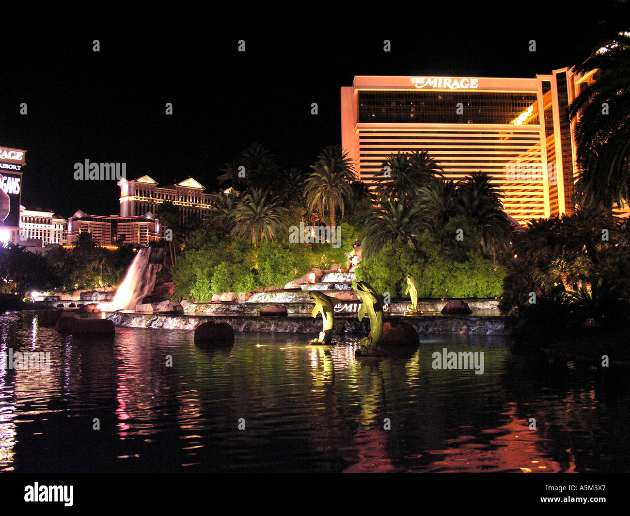 Las Vegas strip night Mirage dolphin pond Stock Photo - Alamy
