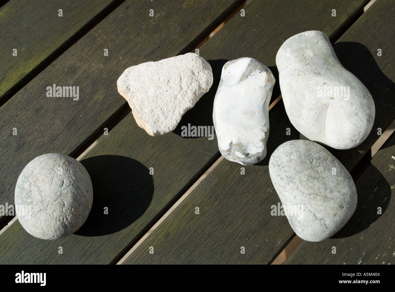 Pebbles on a table Stock Photo - Alamy