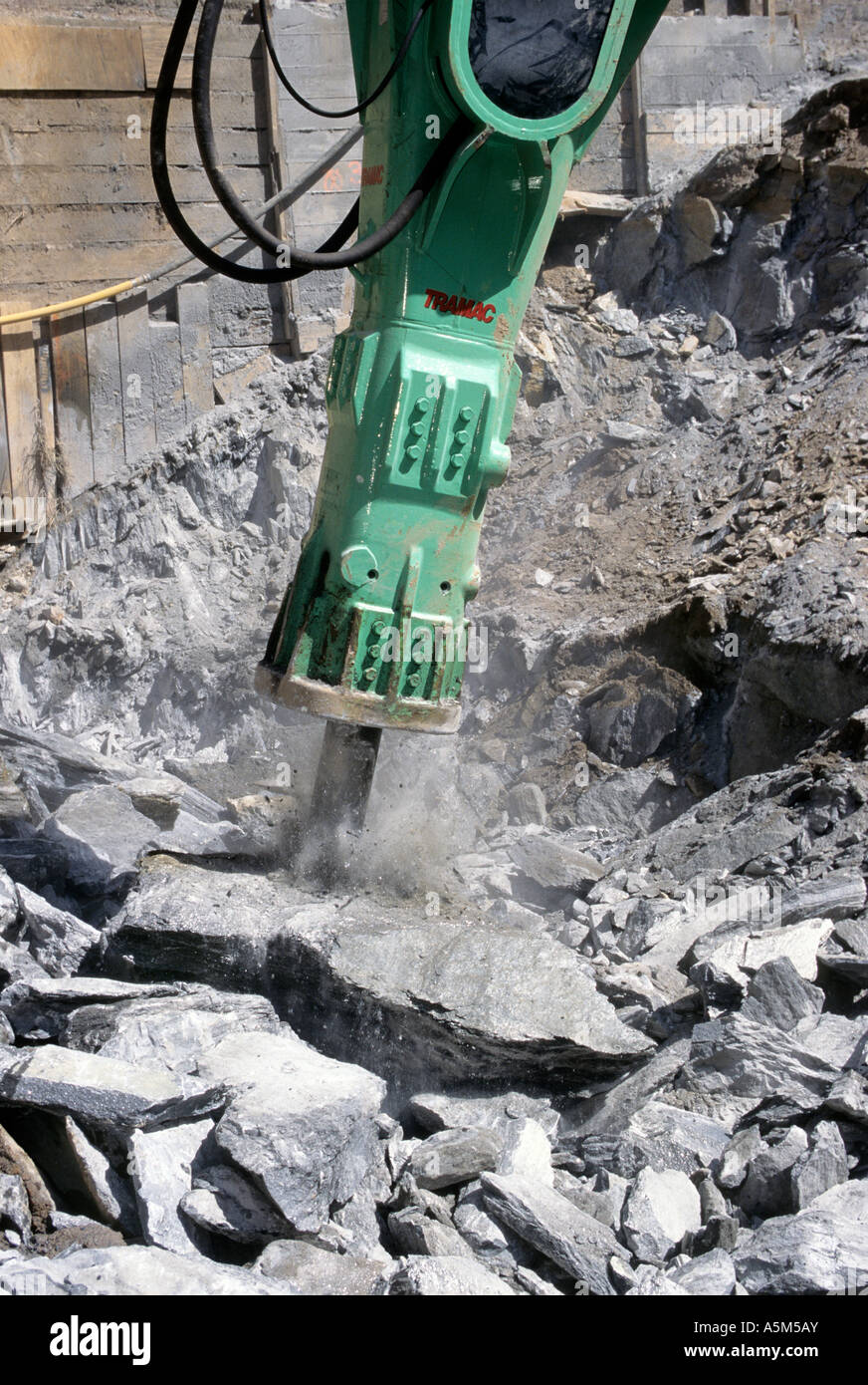 Massive hammer breaking up bedrock for foundation of Random House ...