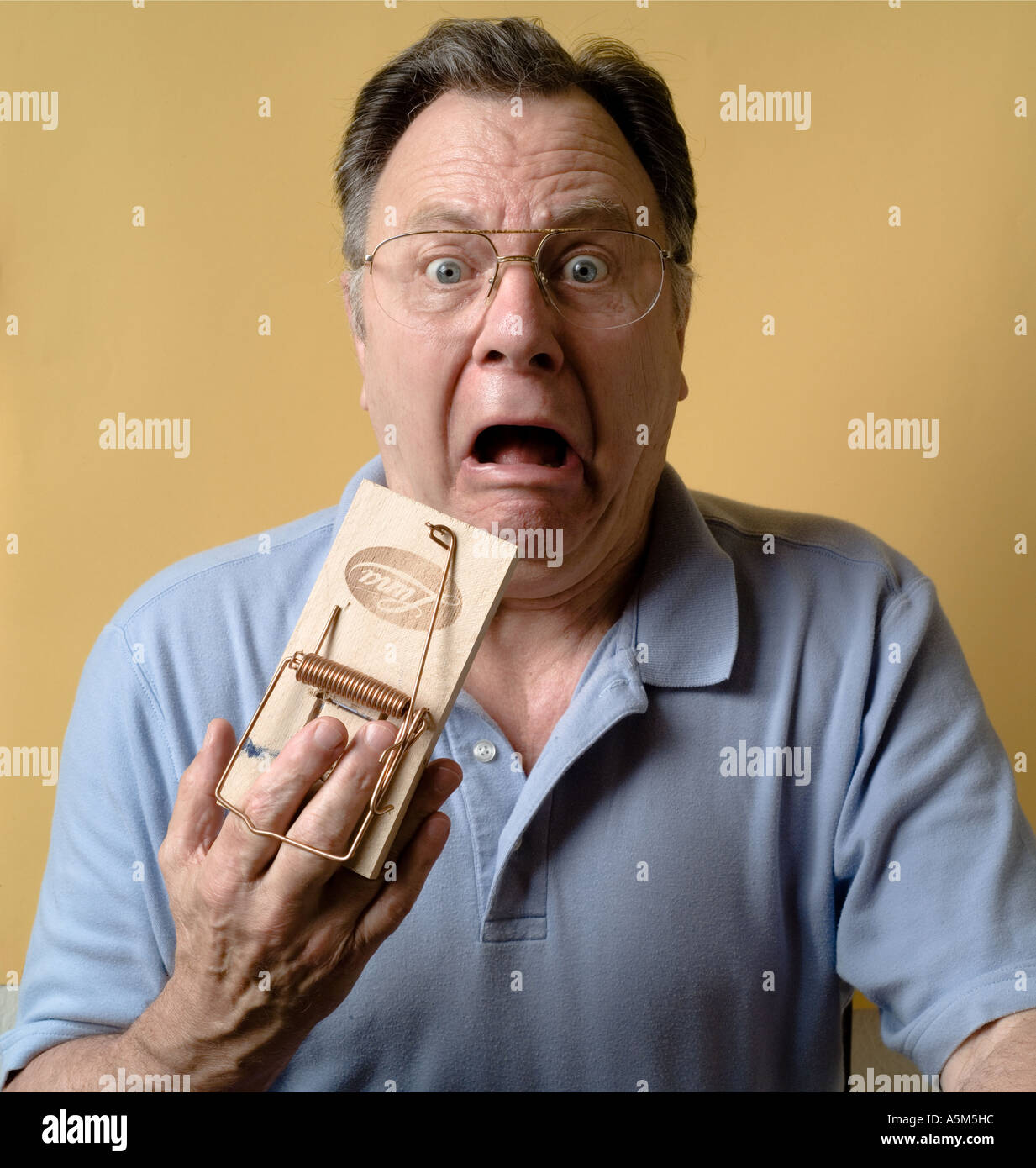 Man caught in mouse trap hi-res stock photography and images - Alamy