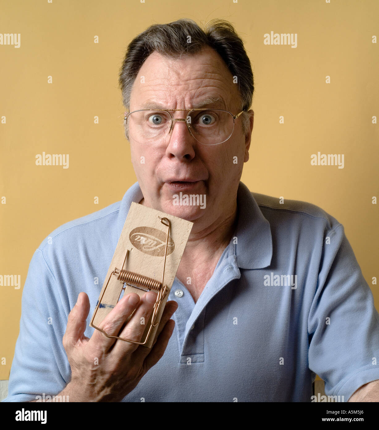 Man caught in mouse trap hi-res stock photography and images - Alamy