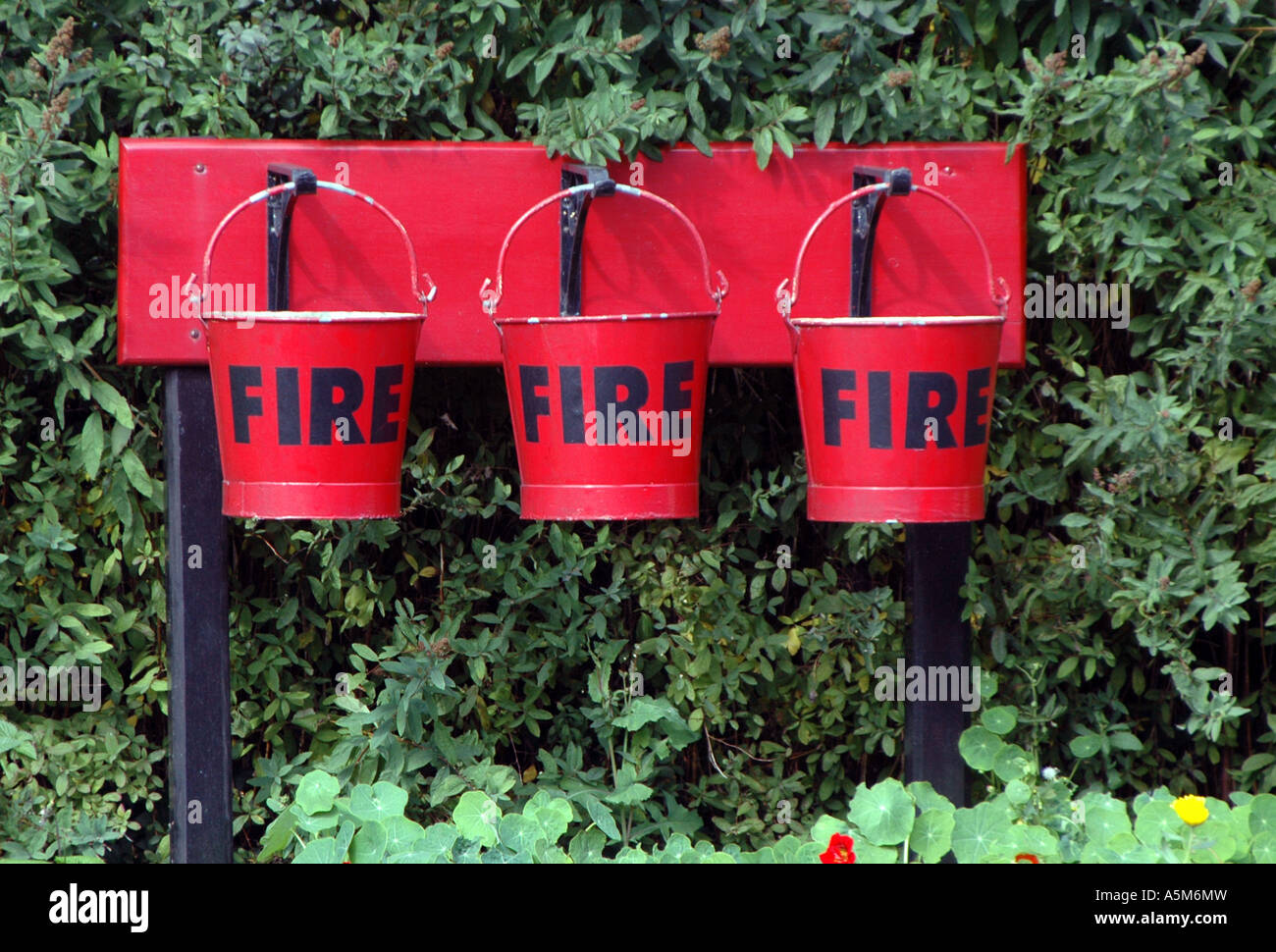 Row of fire buckets Stock Photo - Alamy