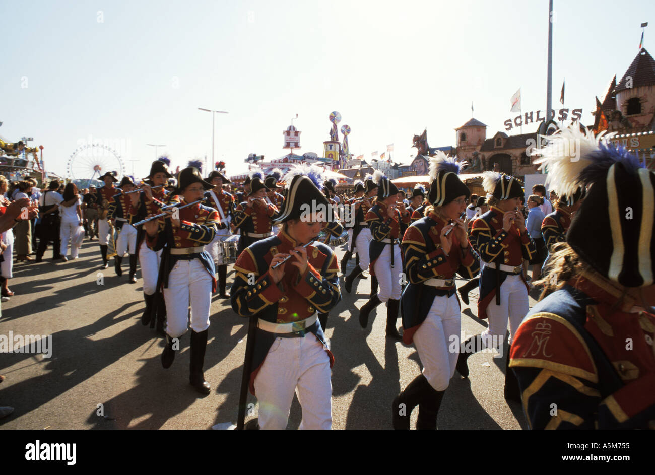 young musicians playing German flutes in traditional uniforms parading ...