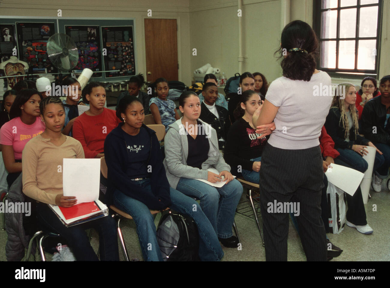 Teacher with students in a biology class lecture at a New York City ...