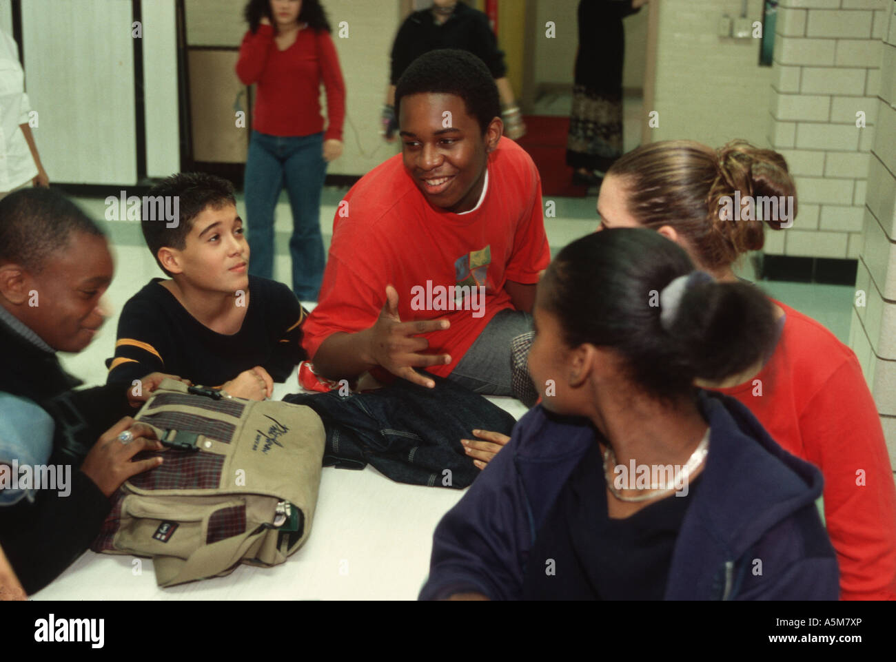 Junior high school students socializing in the lunchroom at a New York ...