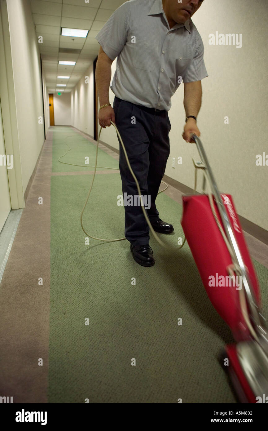 Janitor cleans hallway floor of hi rise office building Stock Photo - Alamy
