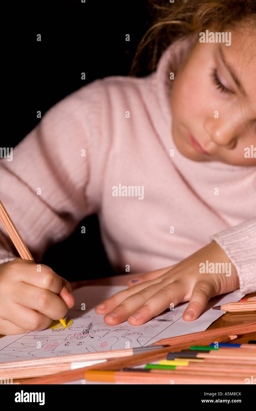 Schoolwork working on her homework Stock Photo - Alamy