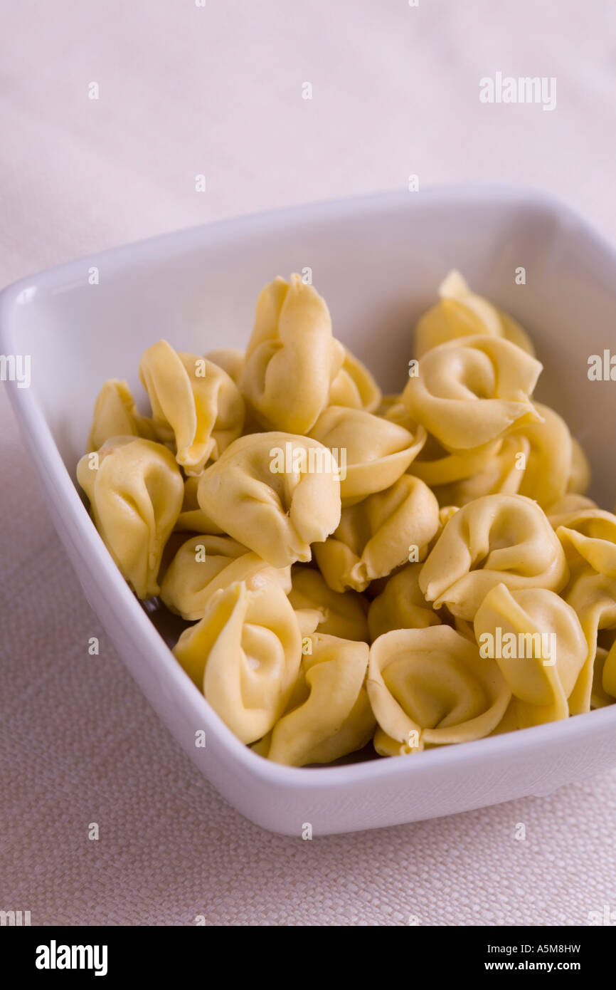 Tortellini noodles in a white bowl Stock Photo - Alamy