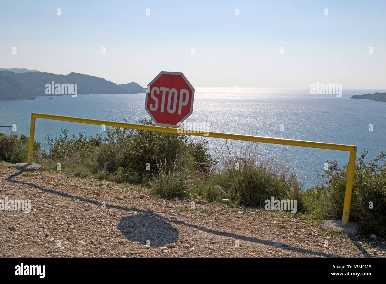 Stop sign at cliff edge, Cape Kefali, near Arilas, Corfu, Oct 2005 ...