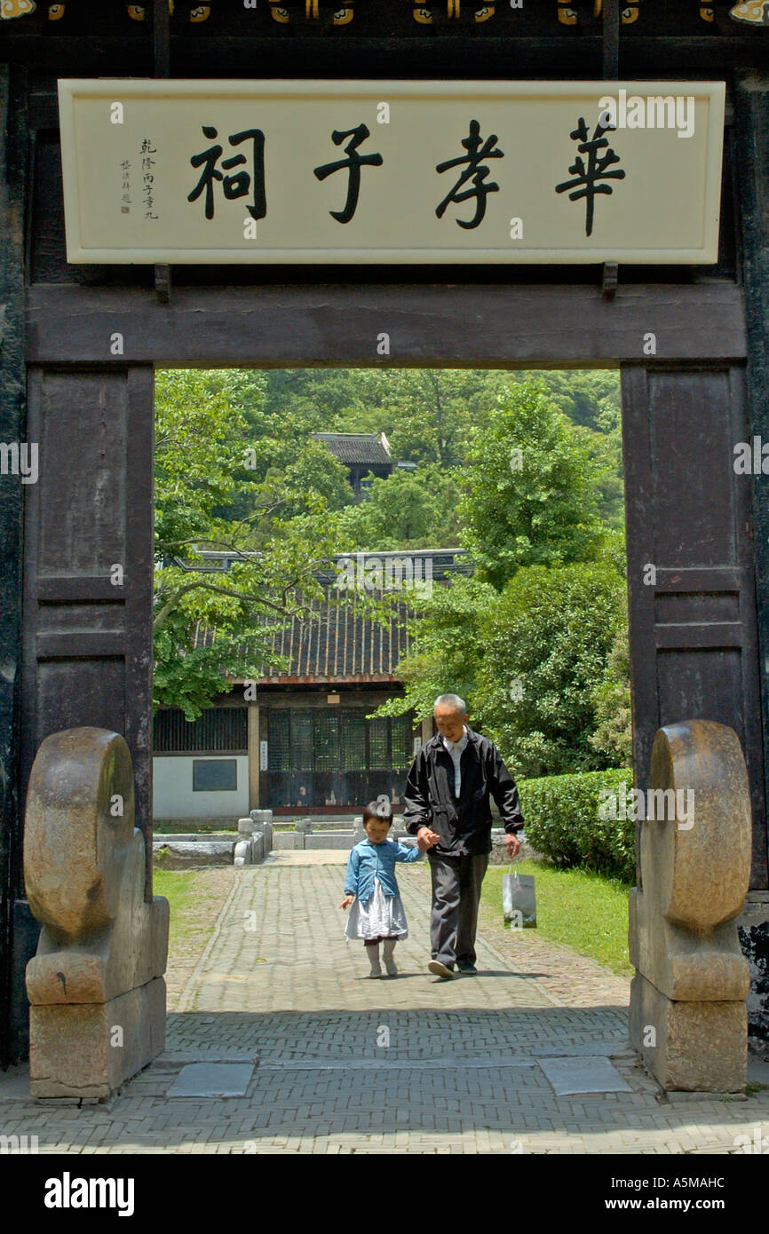 Father and daughter walking under a gate Stock Photo - Alamy