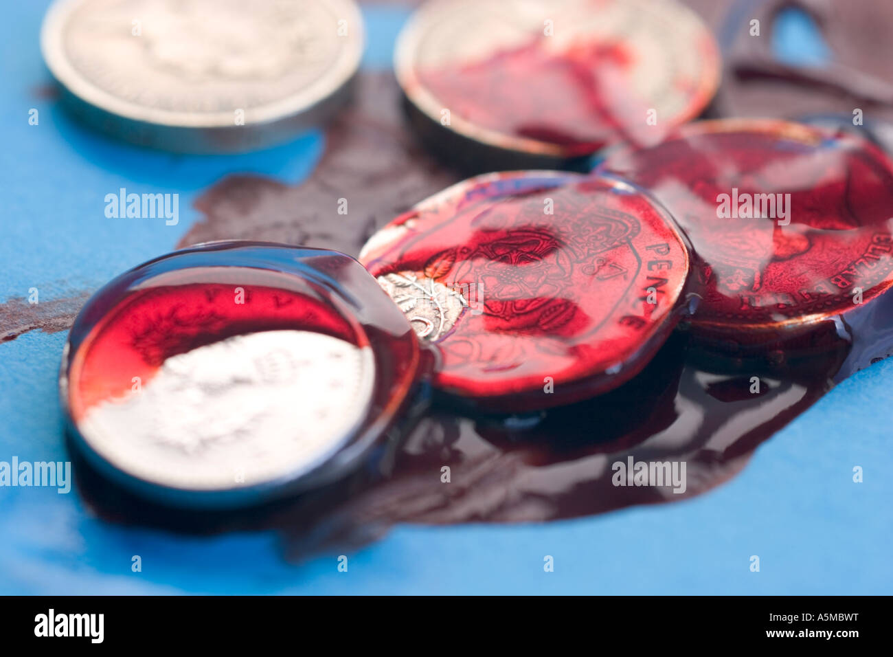 blood money cash sterling coins smeared with blood Stock Photo - Alamy