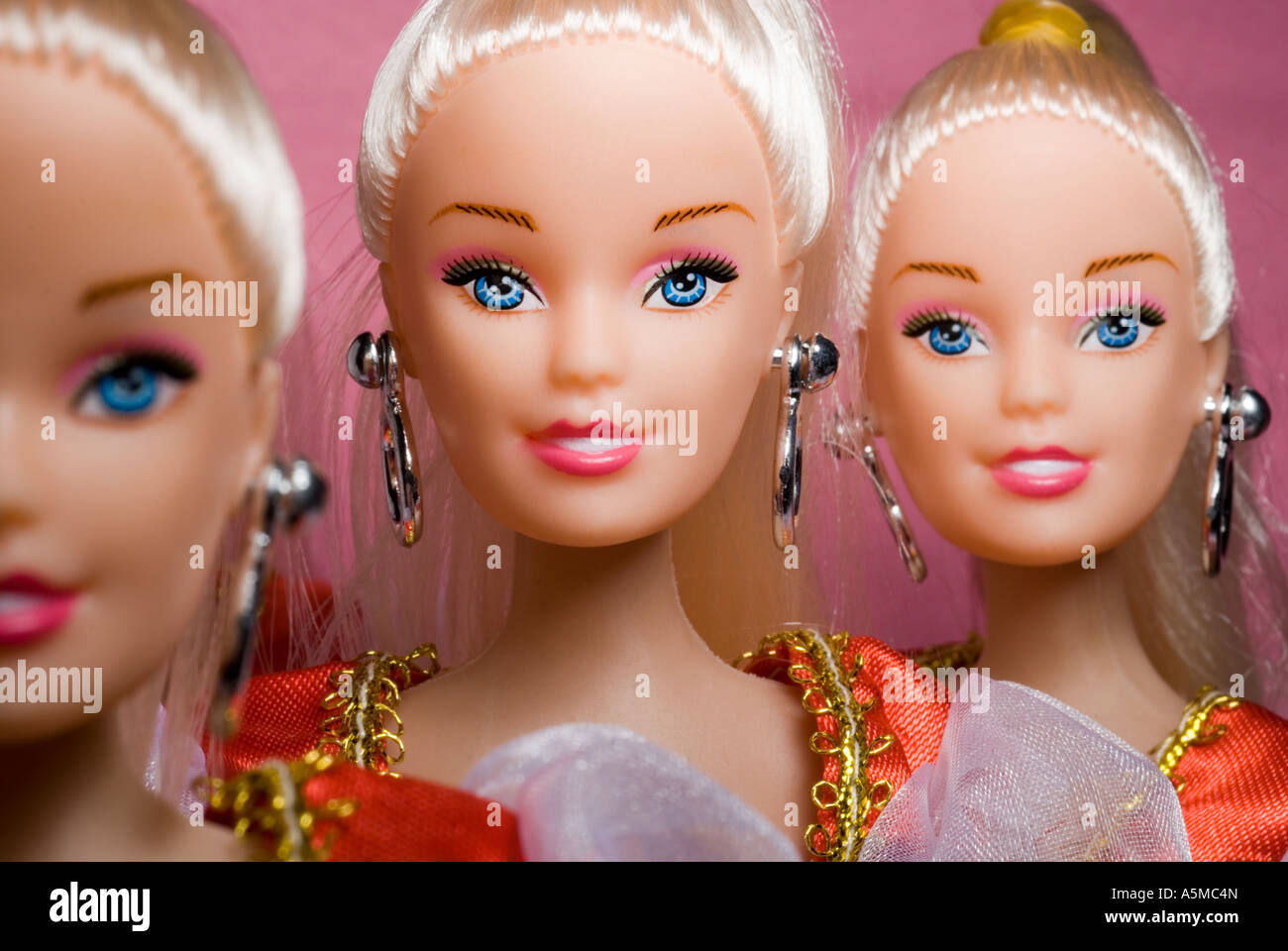 three identical female dolls with blond hair blue eyes head and ...