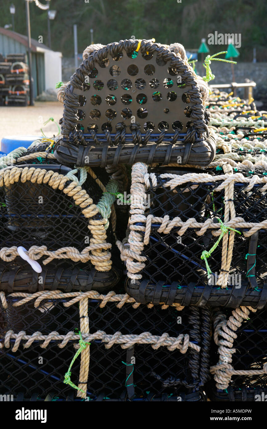 Stacked lobster pots at quayside Stock Photo - Alamy