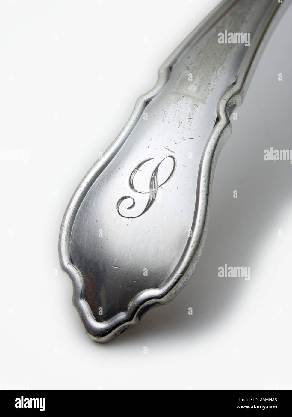Engraved silver spoon Stock Photo - Alamy