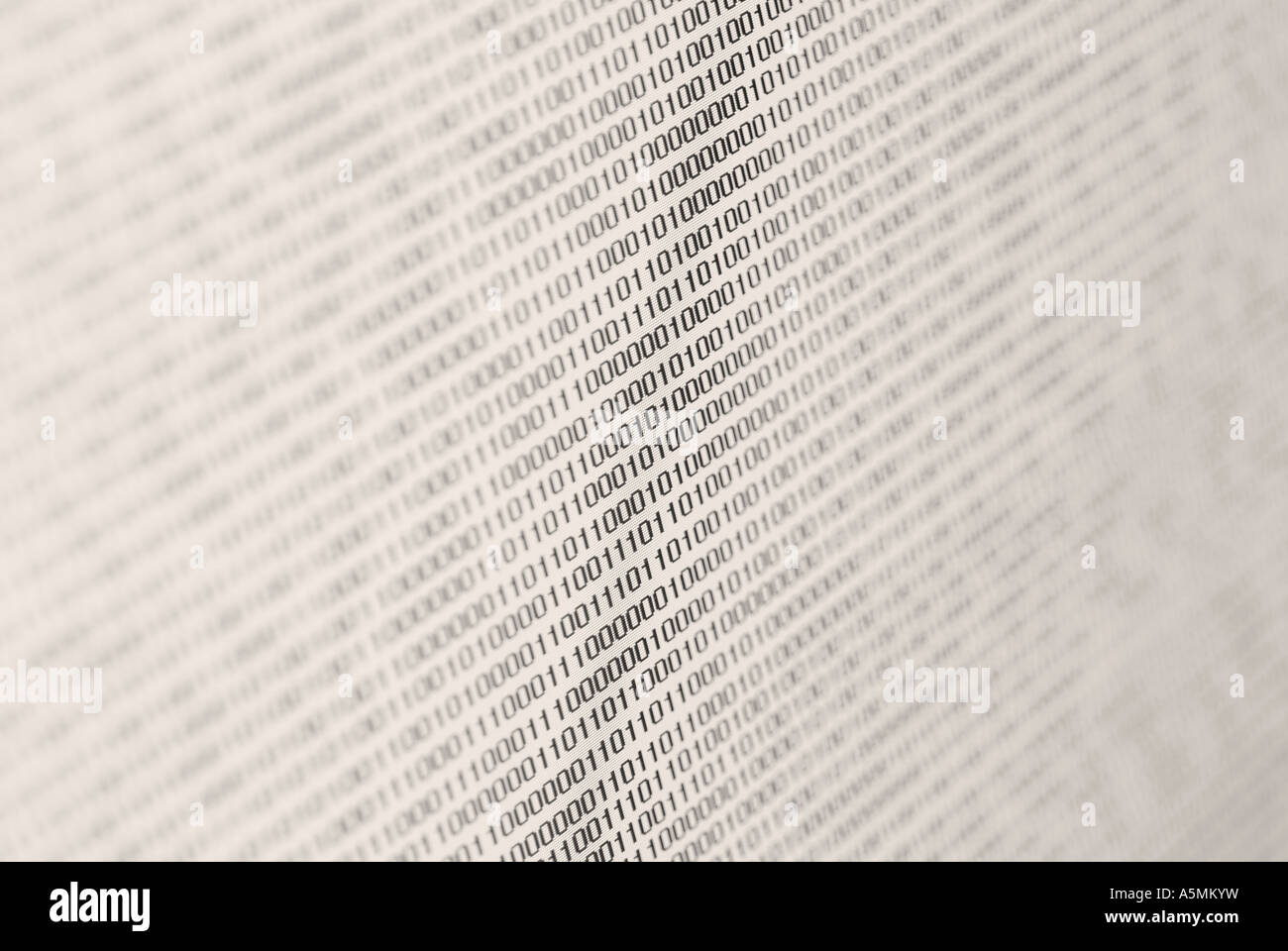 a selective focus closeup of a computer moniter with ones and zero s ...