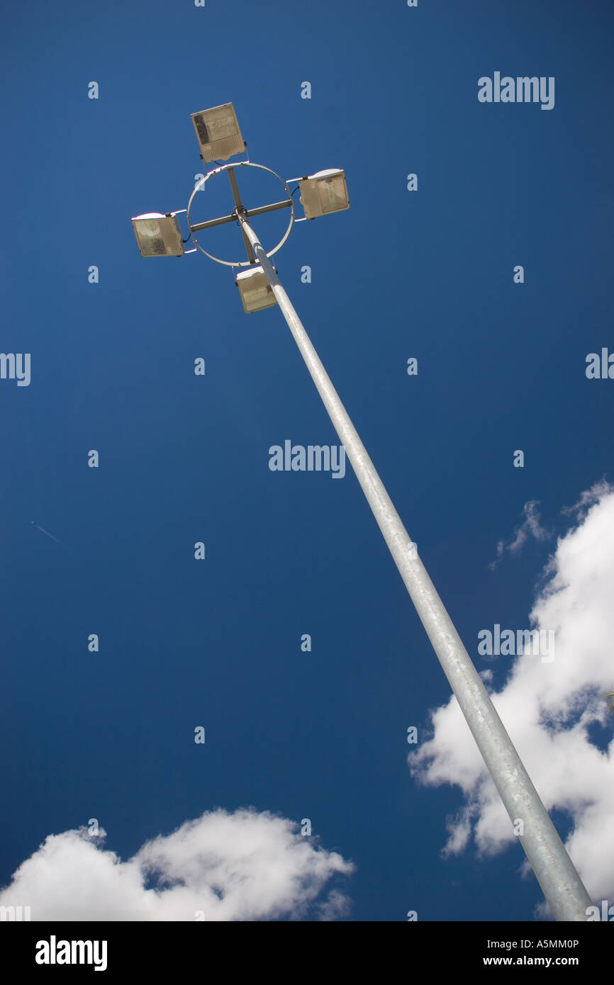 Lampost against a fluffy white clouds and a deep blue sky Stock Photo ...
