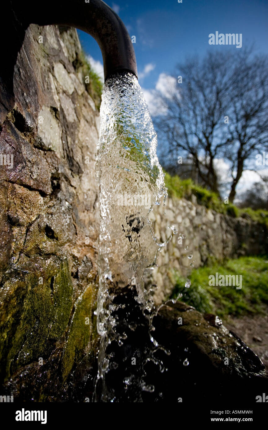Mineral water gushing from a pipe in the Malvern Hills Worcestershire ...