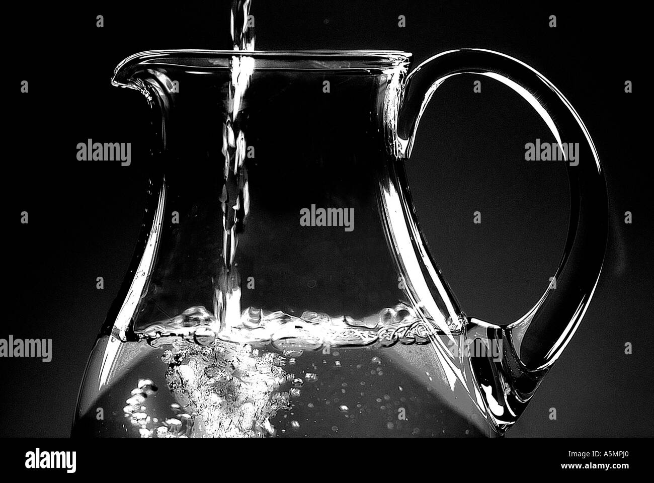 Jug filling Black and White Stock Photos & Images - Alamy