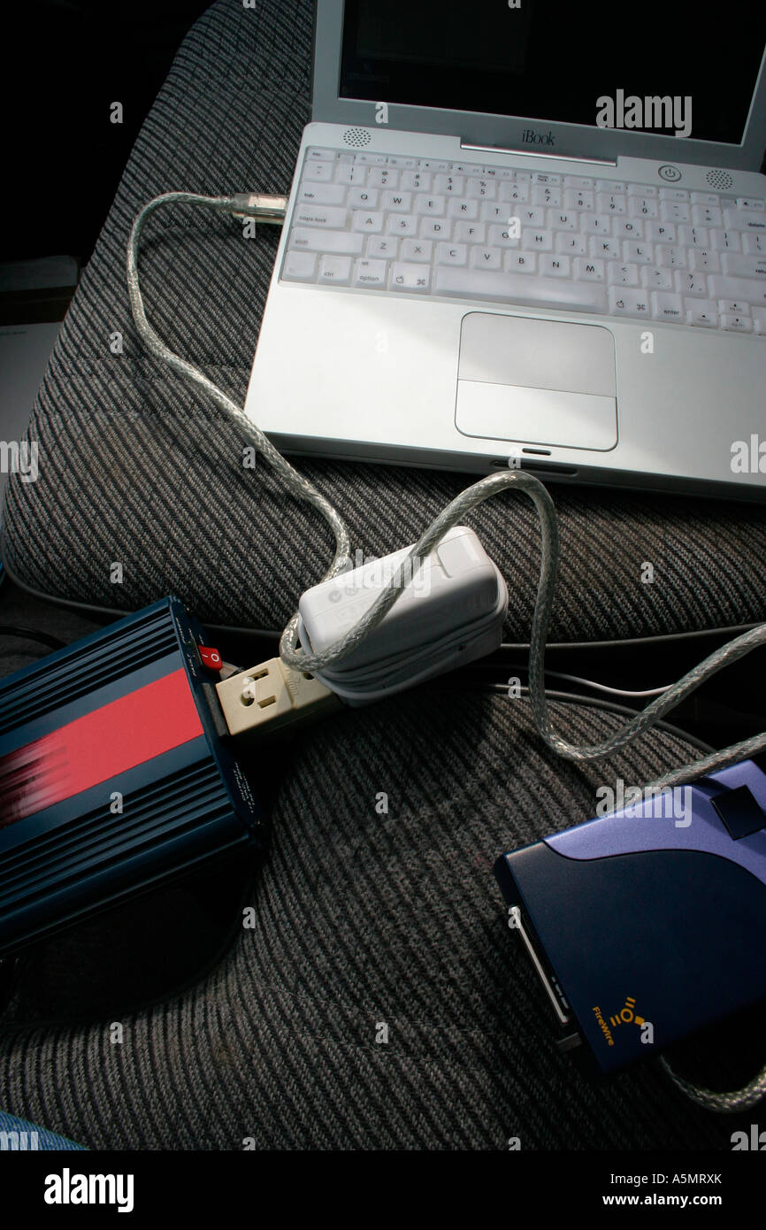 a laptop cigarette lighter power adapter with laptop and peripherals on ...
