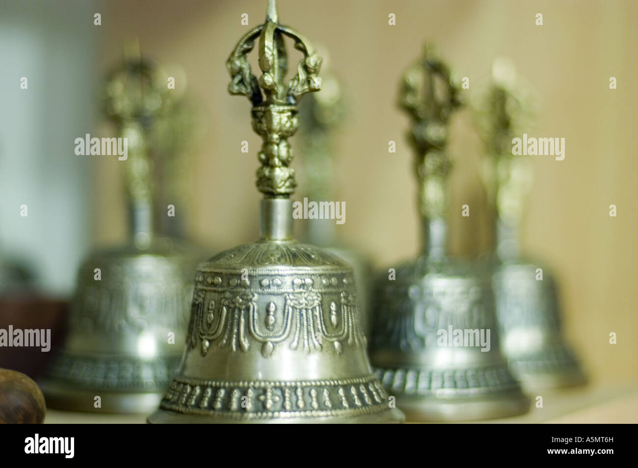 Row of Tibetan Buddhist ritual bells used by monks during pujas ...