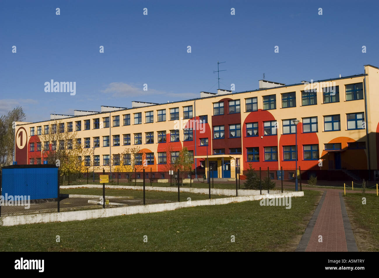 Colourful building of Primary School with blue sky background Grodzisk ...