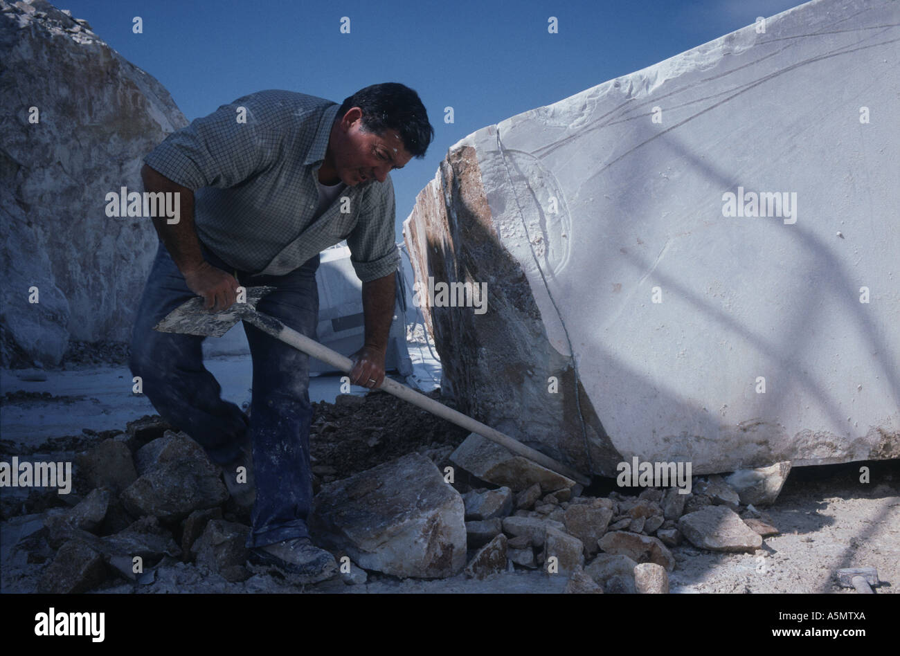 Man at work in a quarry near Carrara. Italy, July 2005 Stock Photo - Alamy