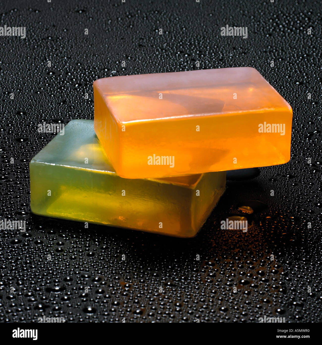 Coloured soap on black background Stock Photo - Alamy