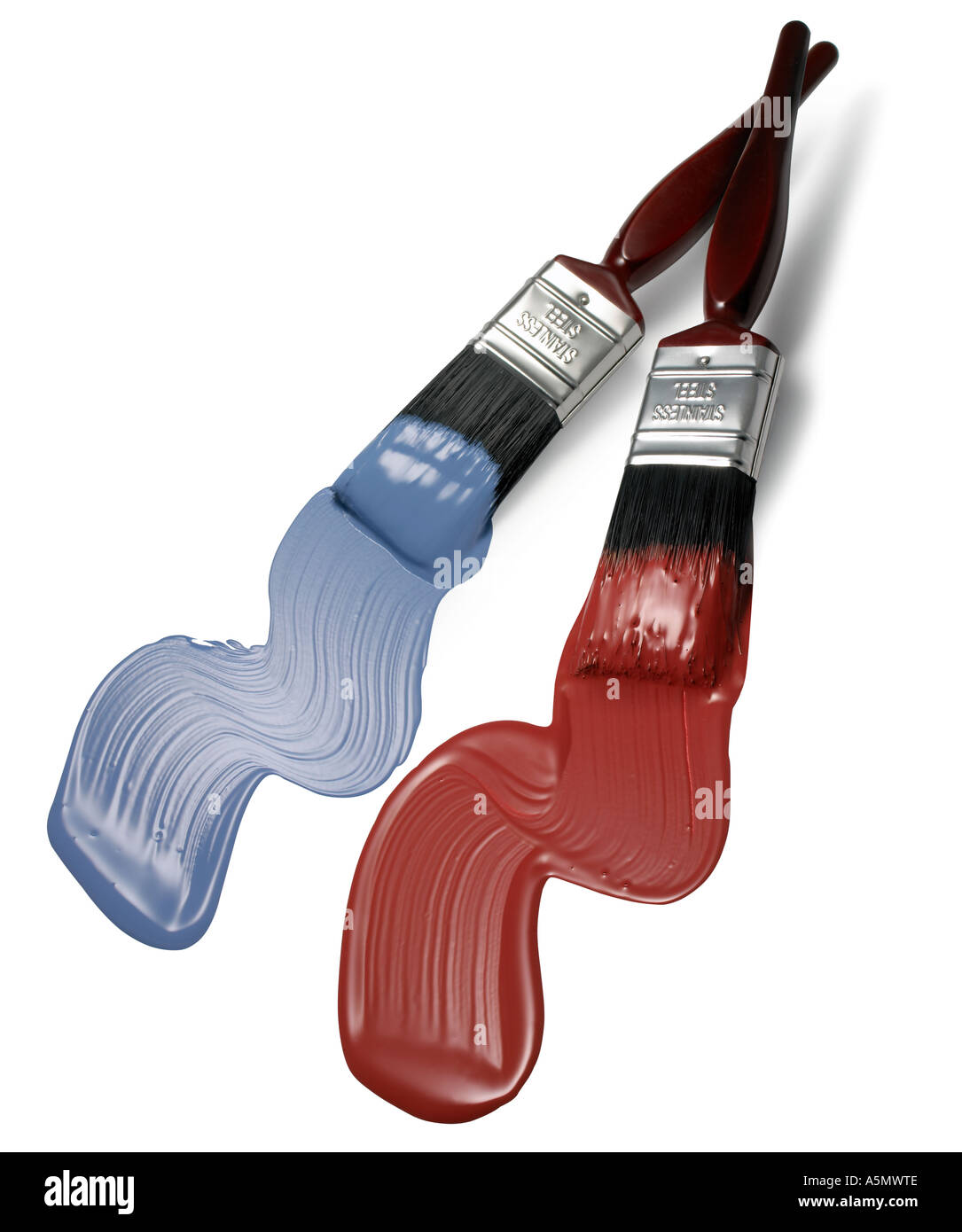 Paint brushes with paint cut out on white background Stock Photo - Alamy