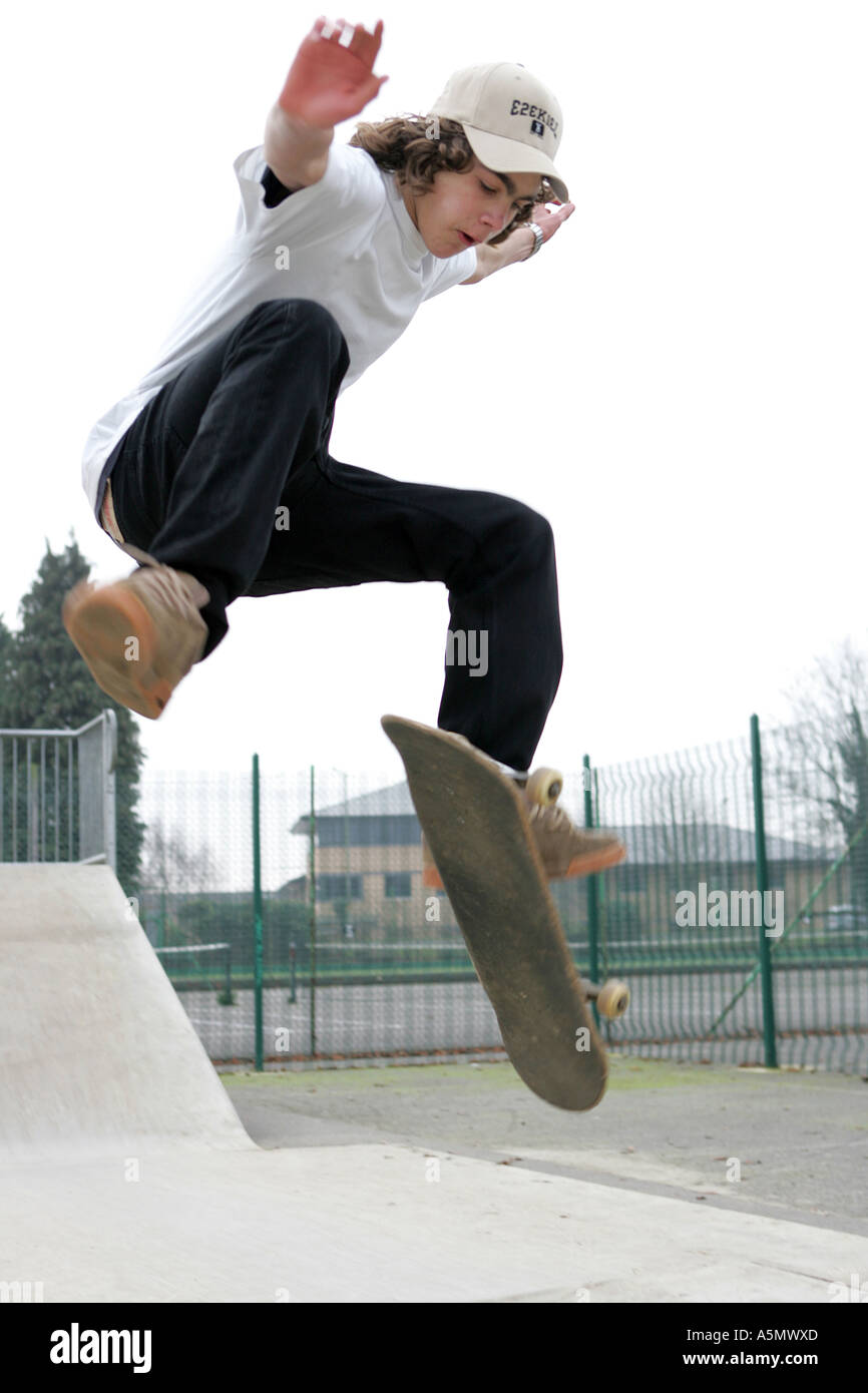 MALE SKATEBOARDER PERFORMING A TRICK OFF A RAMP Stock Photo - Alamy