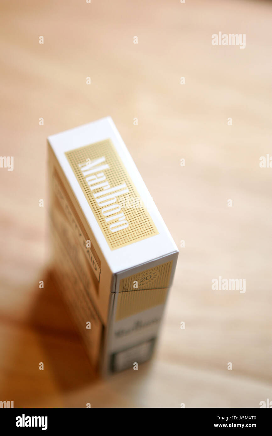 CLOSED PACKET OF CIGARETTES ON A TABLE STANDING Stock Photo - Alamy