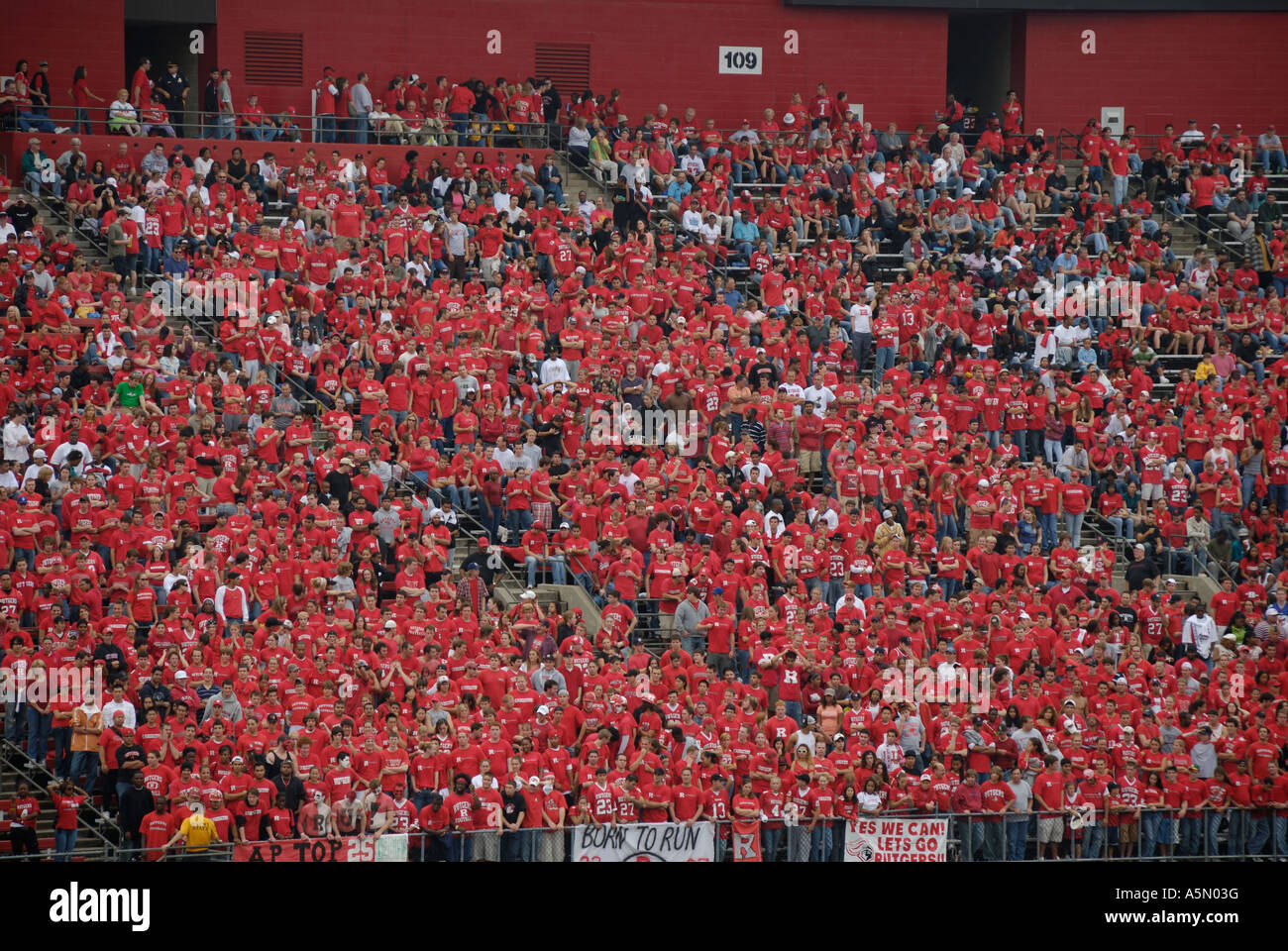 a cropped view of a section of fans at a college football game Stock ...
